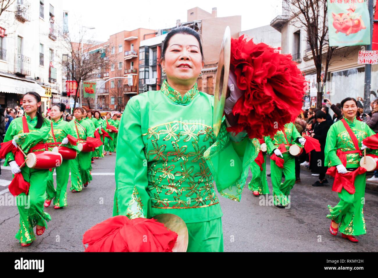 Chinese women wearing traditional dresses are seen playing traditional ...