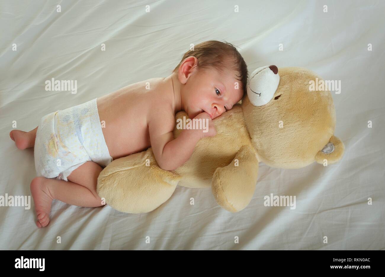Baby and teddy hi-res stock photography and images - Alamy