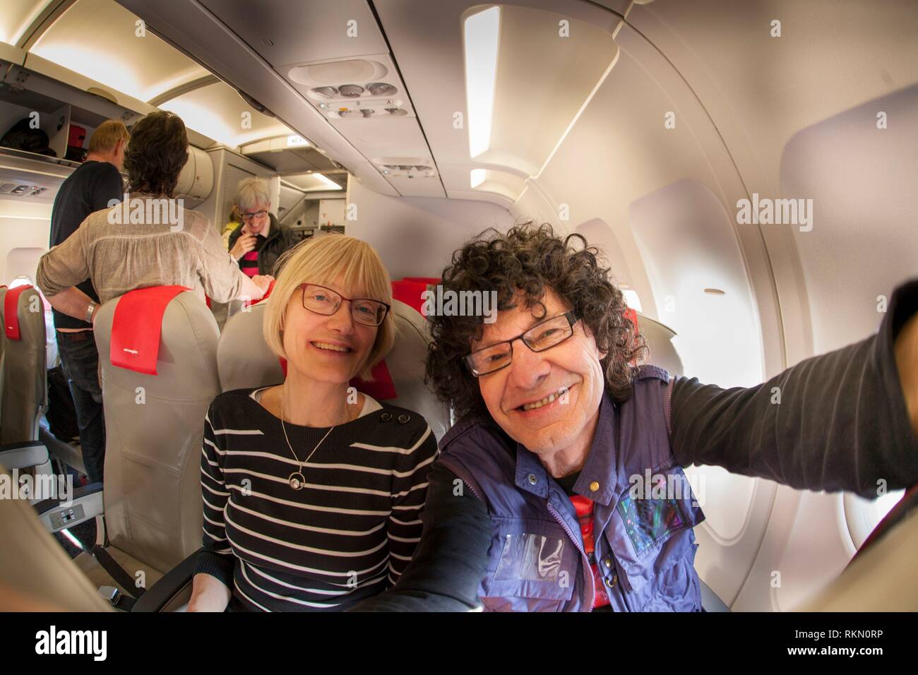 Selfie of a couple onboard plane Stock Photo - Alamy