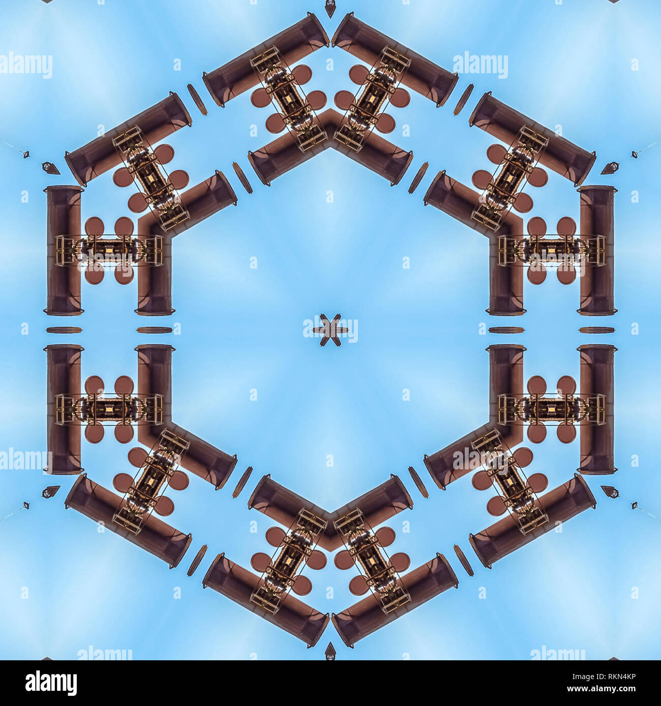 Badge shape with metal barrels and pipes in sky. Geometric kaleidoscope ...