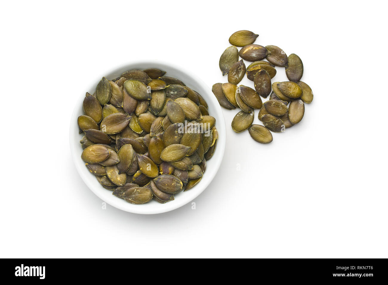 Peeled pumpkin seeds isolated on white background Stock Photo - Alamy