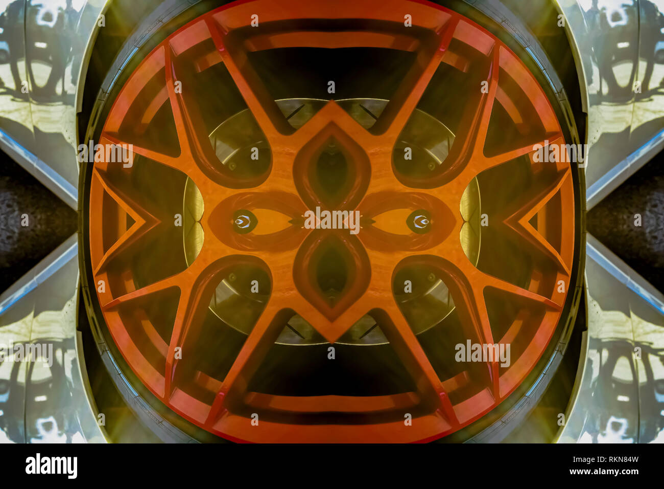 Red car rims made into a reflective design. Geometric kaleidoscope ...