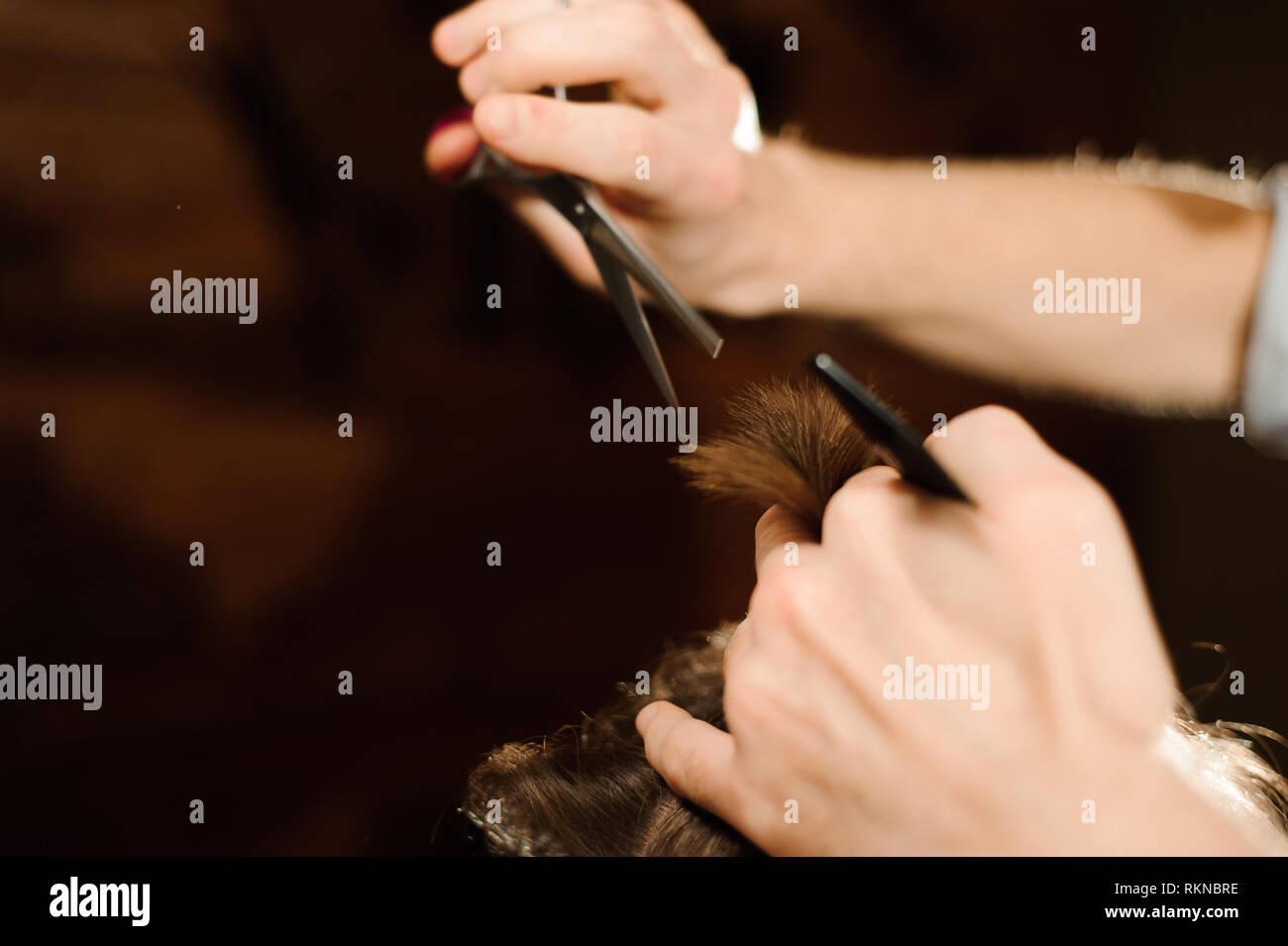 Master cuts hair and beard of men in the barbershop Stock Photo - Alamy