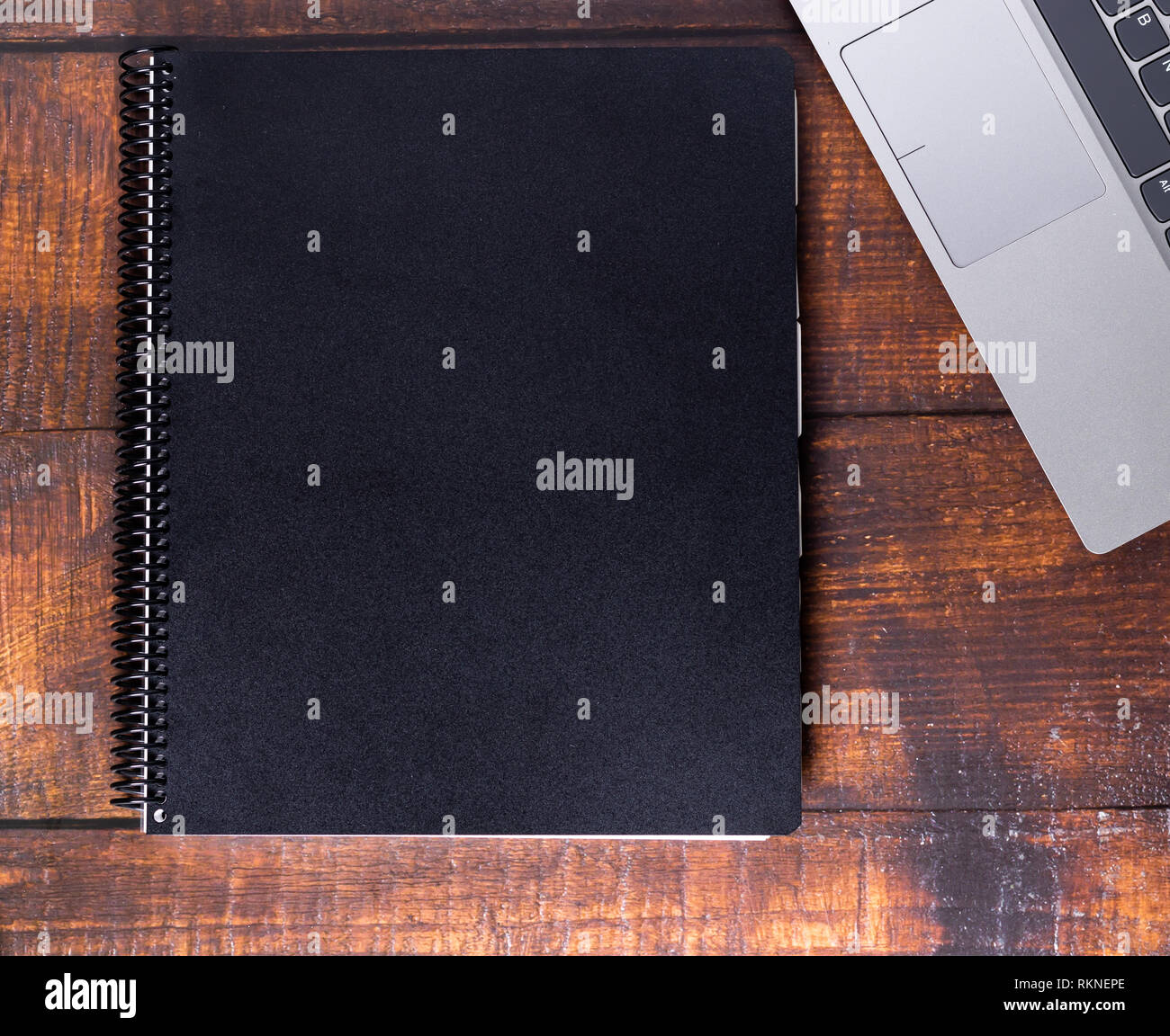 Notebook on desk Stock Photo - Alamy