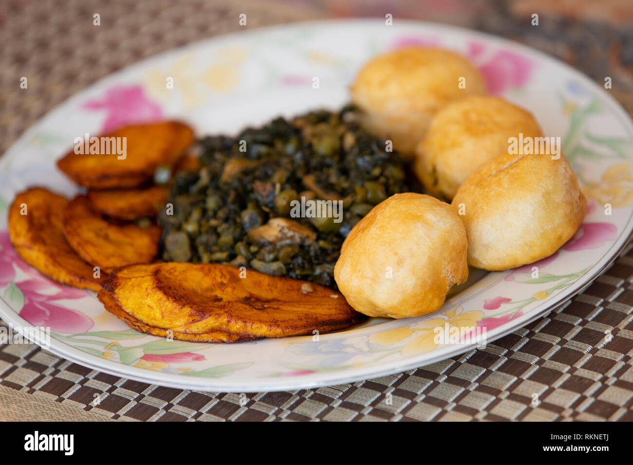 Jamaican Breakfast. Fried Plantains & Dumplings and callaloo Stock ...