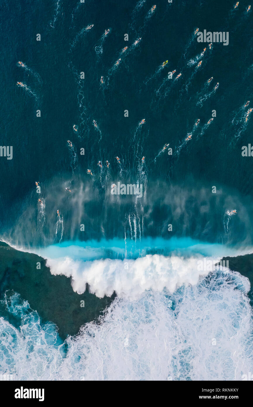 An overhead view of surfers at Pipeline on the North Shore of Oahu,HI ...