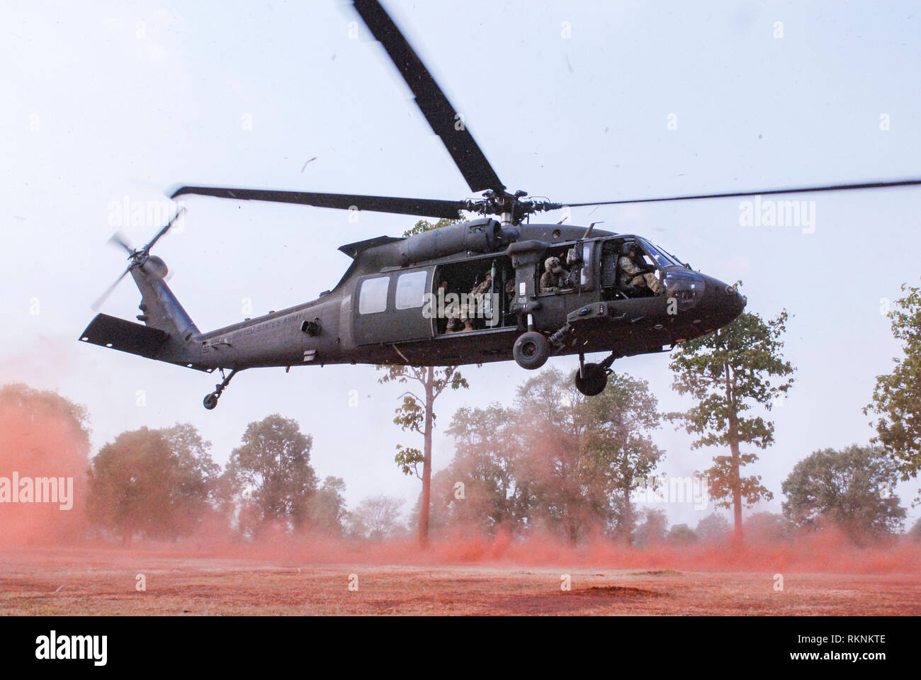 U.S. and Royal Thai Army soldiers depart the landing zone in a Sikorsky UH-60 Black Hawk during ...