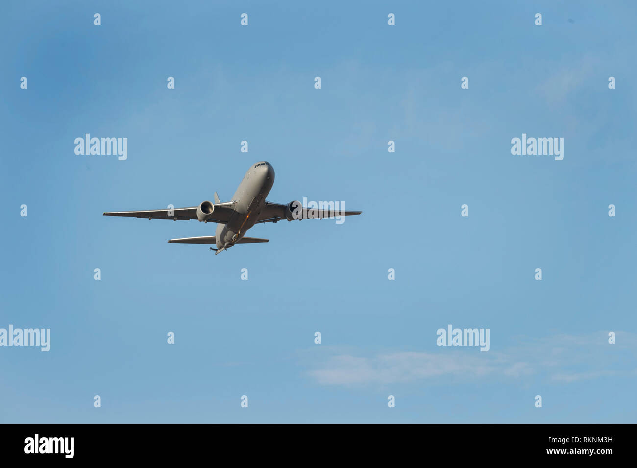 A KC-46a Pegasus flies over the flightline of the 97th Air Mobility ...