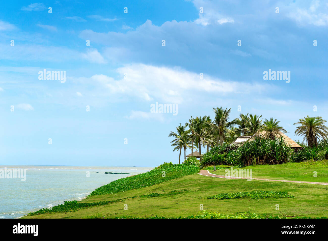 The seaside pavilion and palm trees, the landscape of Hainan Island ...