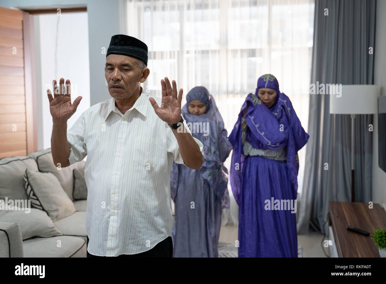 portrait of old man leading a praying in congregation Stock Photo - Alamy