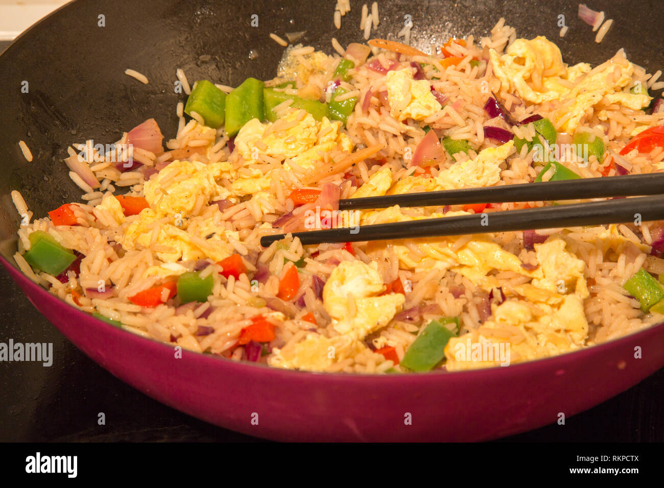 Chinese style Egg fried rice cooking in a wok Stock Photo - Alamy