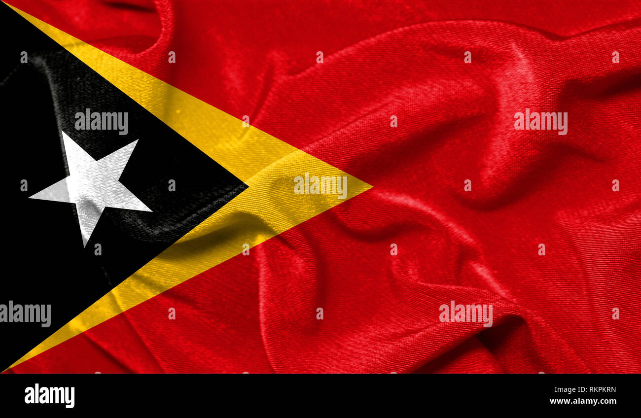 Realistic flag of East Timor on the wavy surface of fabric Stock Photo ...