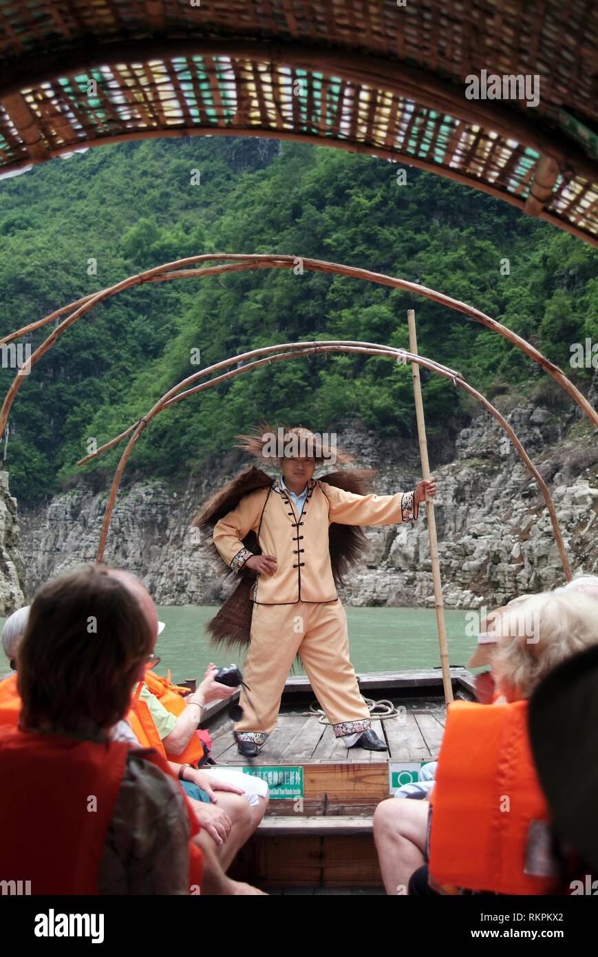 A tourist boat makes its way along the Daning River Small Gorges, a ...