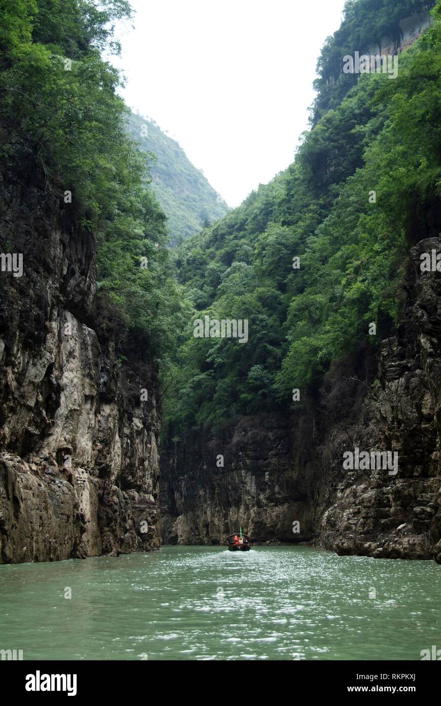 A tourist boat makes its way along the Daning River Small Gorges, a ...