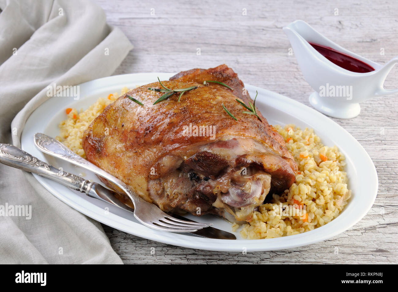 Baked turkey thigh with garnish bulgur and vegetables Stock Photo - Alamy