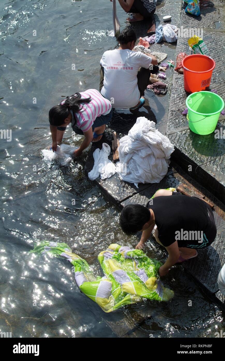 Ladies Washing Clothes At The River High Resolution Stock Photography ...