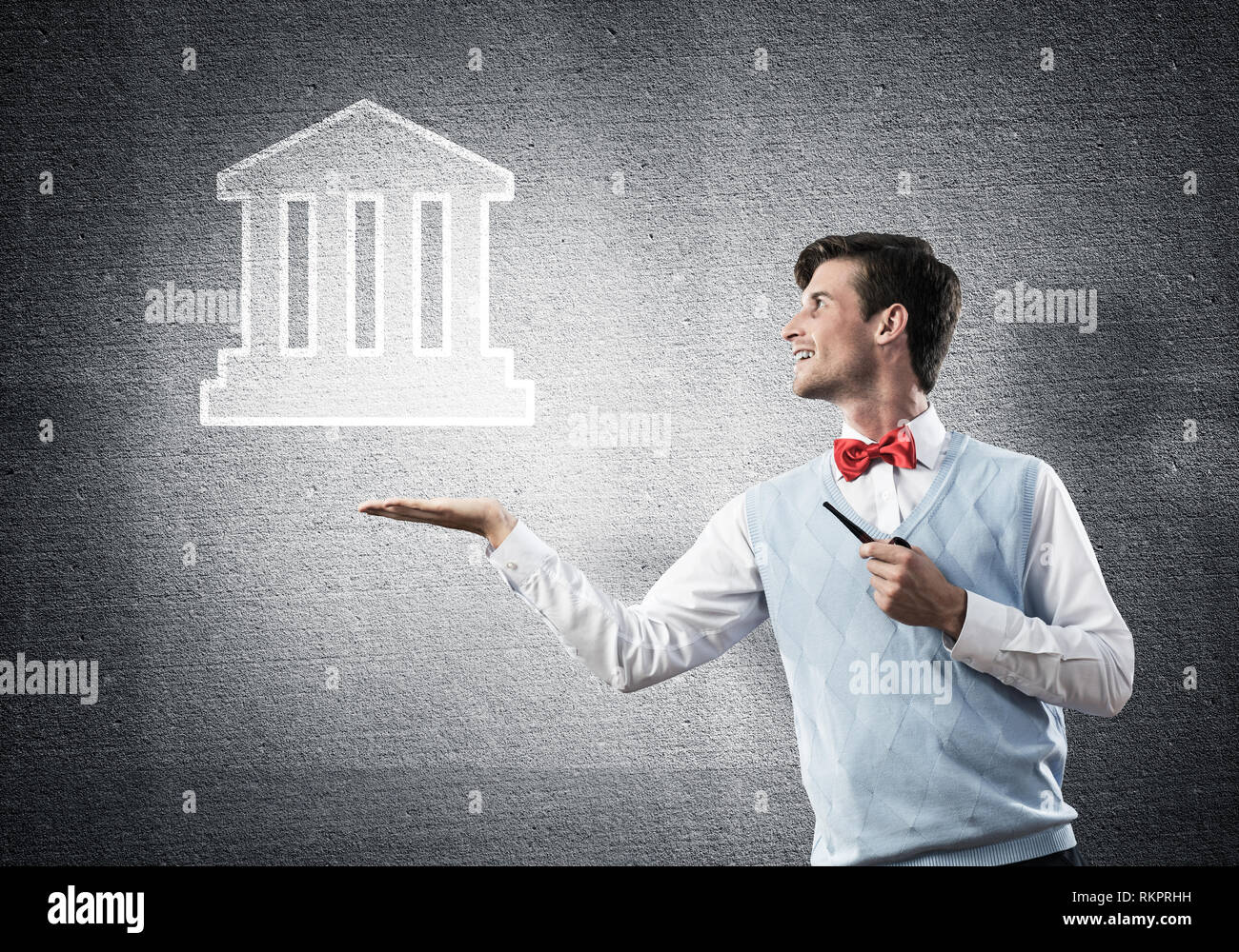 Elegant banker wearing red tie and house sign as banking concept Stock ...