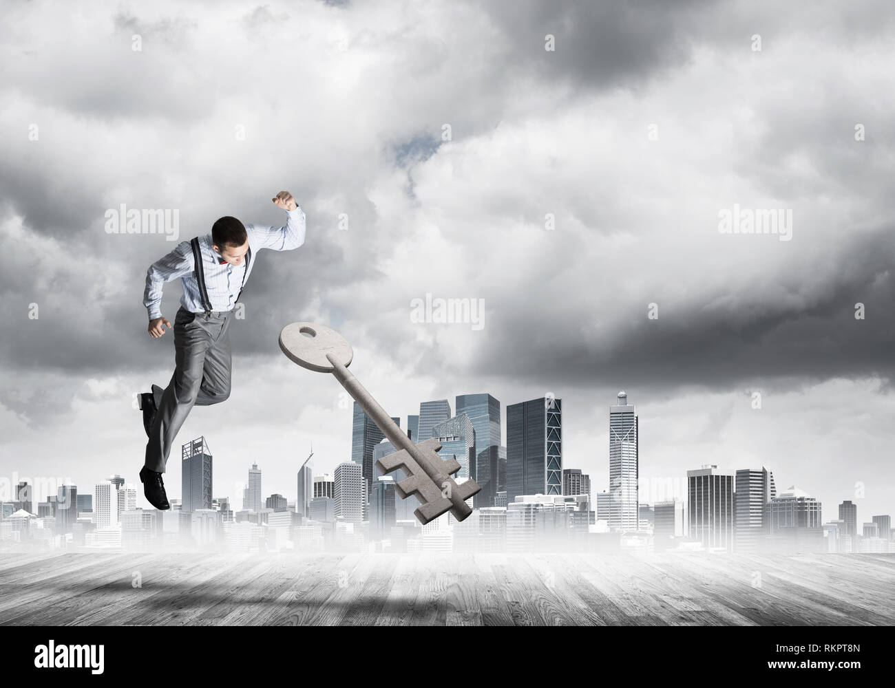 Breaking through access concept with furious man crashing concrete key ...
