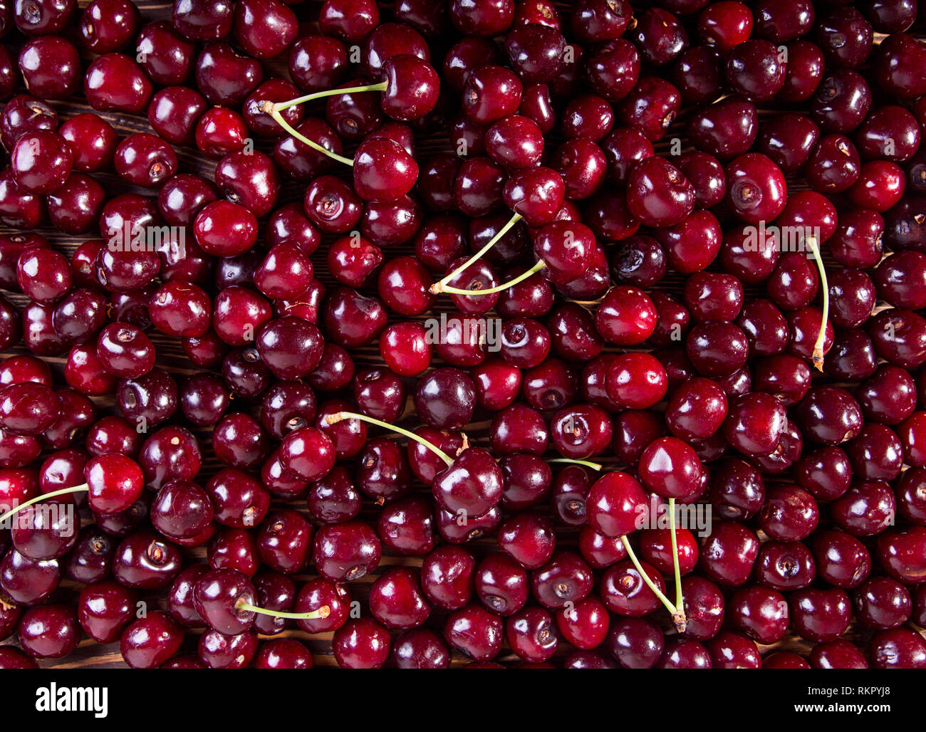 Sweet cherry background Stock Photo - Alamy