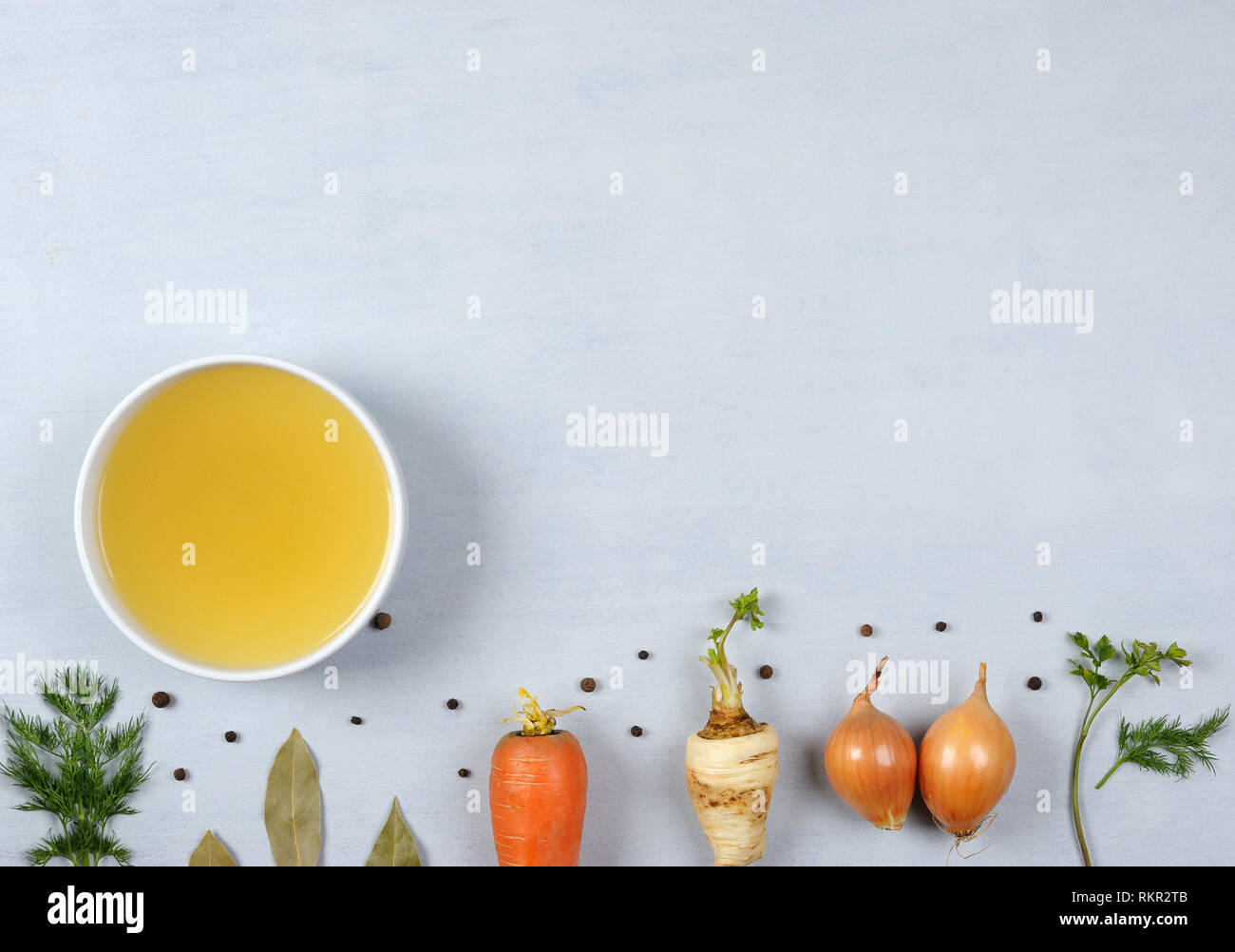 Broth with ingredients.Clear broth is made by simmering meat or bones ...