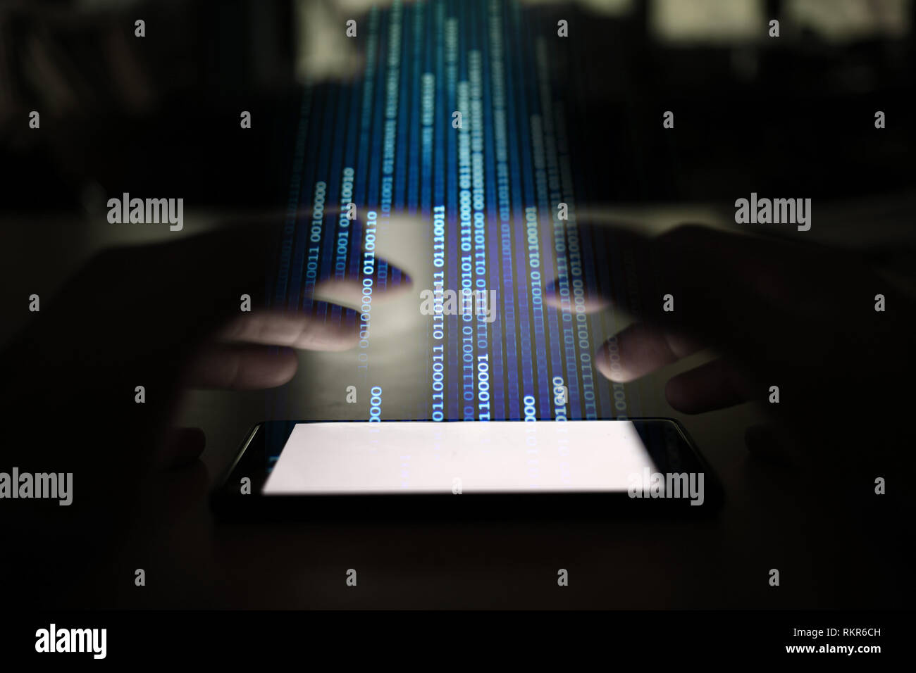 transfer data via mobile device. smart phone with blue working hands ...