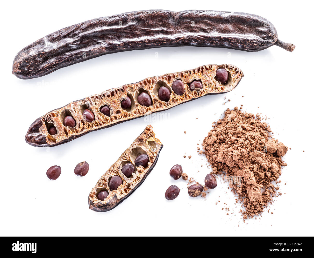 Carob pods and carob powder on the white background Stock Photo - Alamy