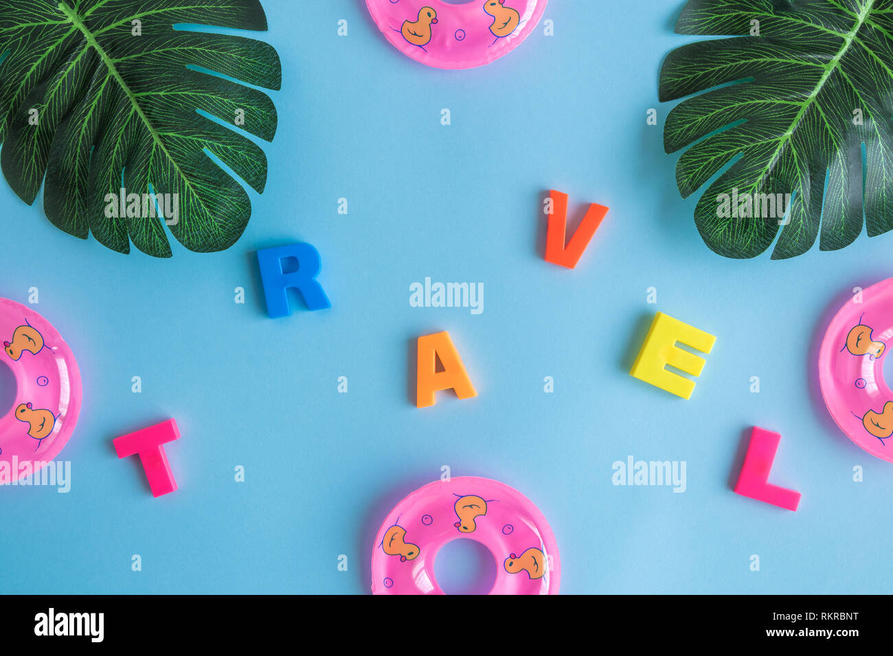 Flat lay of summer vacation minimal concept made of colorful letters ...
