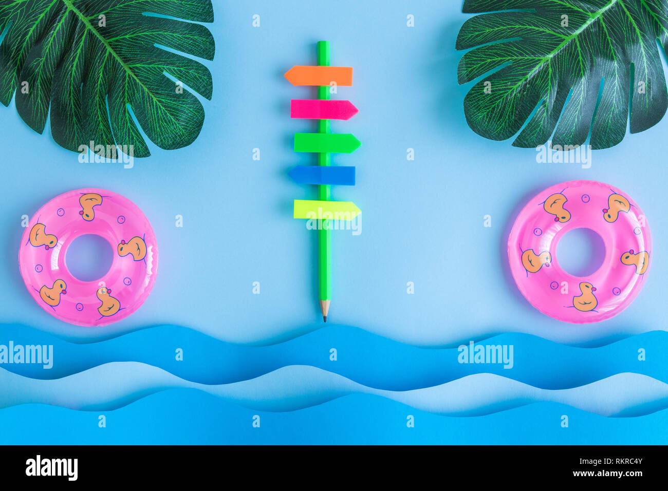 Direction sign made of pencil and colorful sticky notes with waves ...