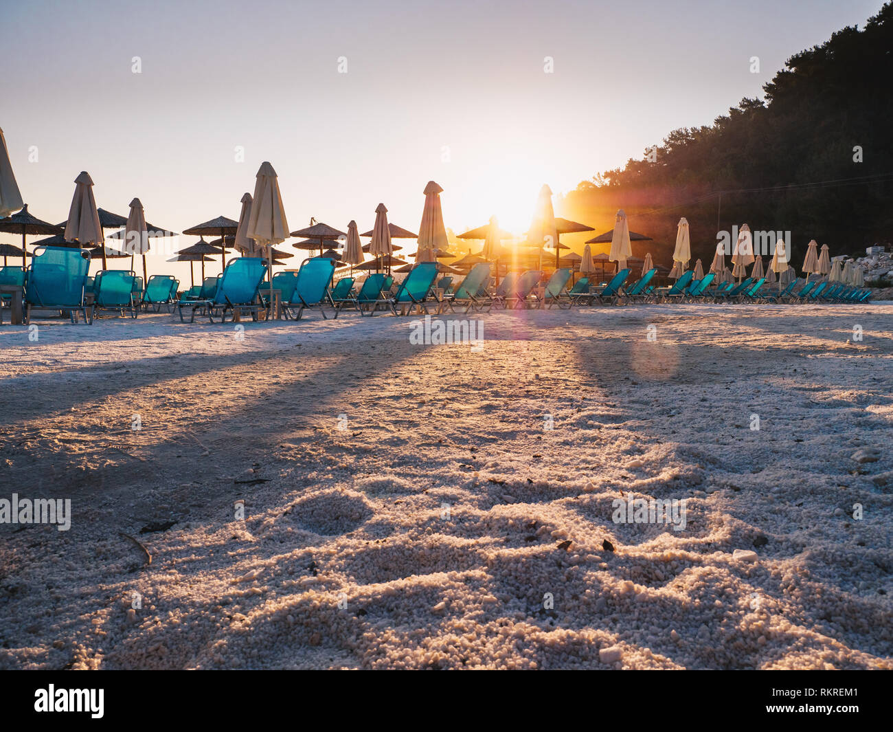 Sunrise light at Porto Vathy beach in Greece. Lens flare effect ...