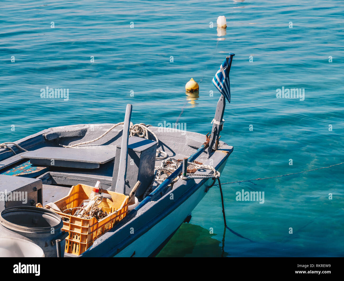 Detail view of a traditional greek fishing boat with Greek Flag in ...