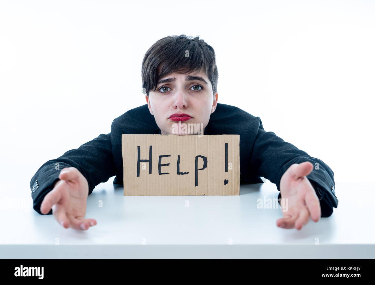 Beautiful business woman feeling overwhelmed and desperate asking for ...