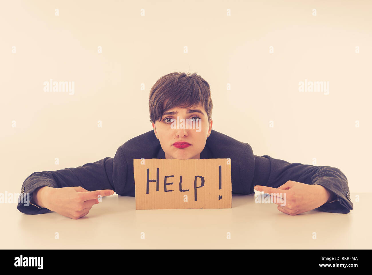 Beautiful business woman feeling overwhelmed and desperate asking for ...