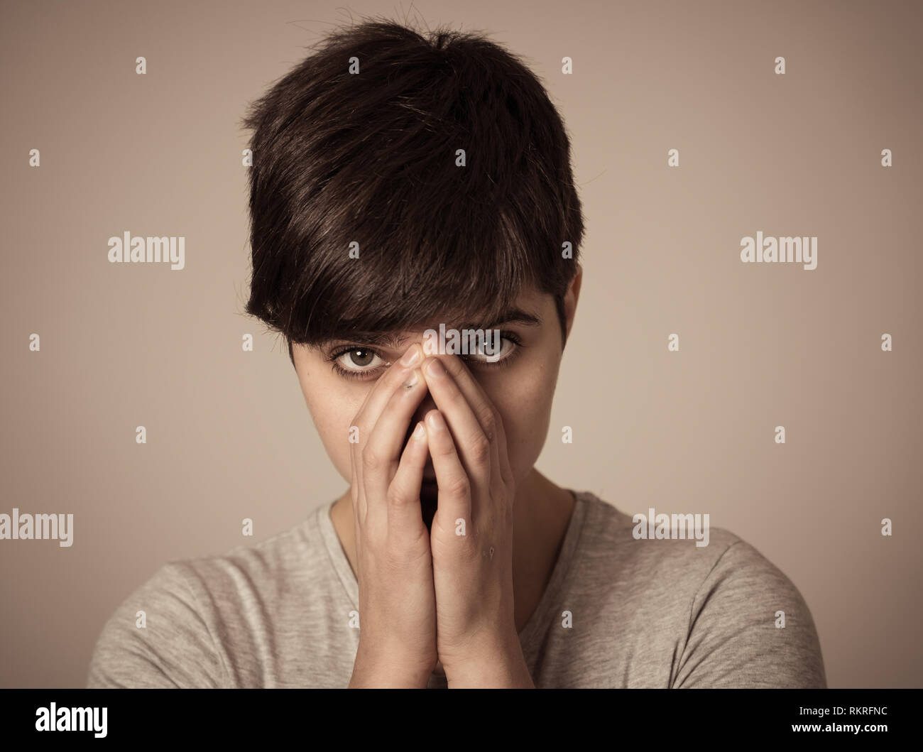 Close up portrait of beautiful young woman with sad eyes looking ...