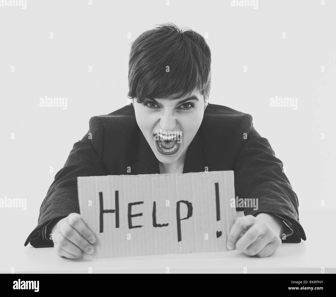 Beautiful business woman feeling overwhelmed and desperate asking for ...