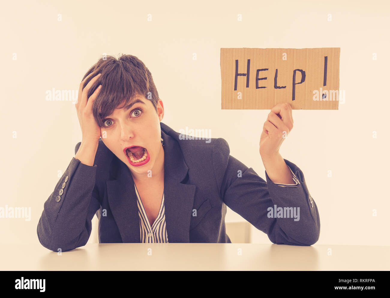Beautiful business woman feeling overwhelmed and desperate asking for ...