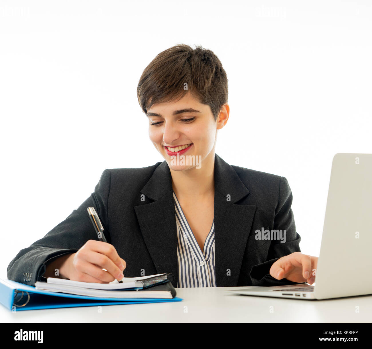 Happy, smiling and successful businesswoman working on computer laptop ...