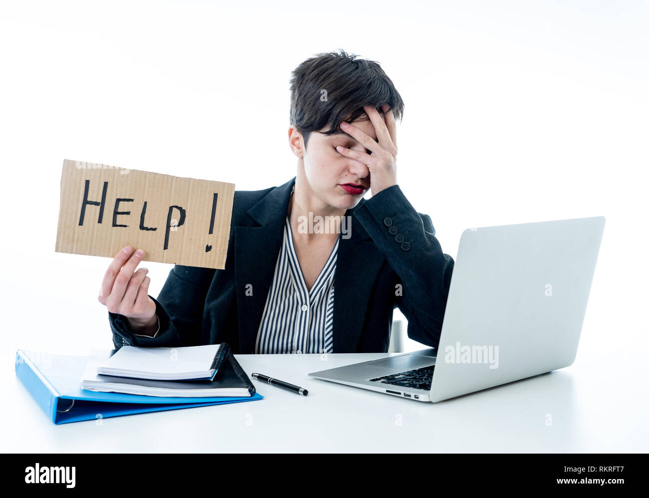 Tired and frustrated young attractive business woman working on ...