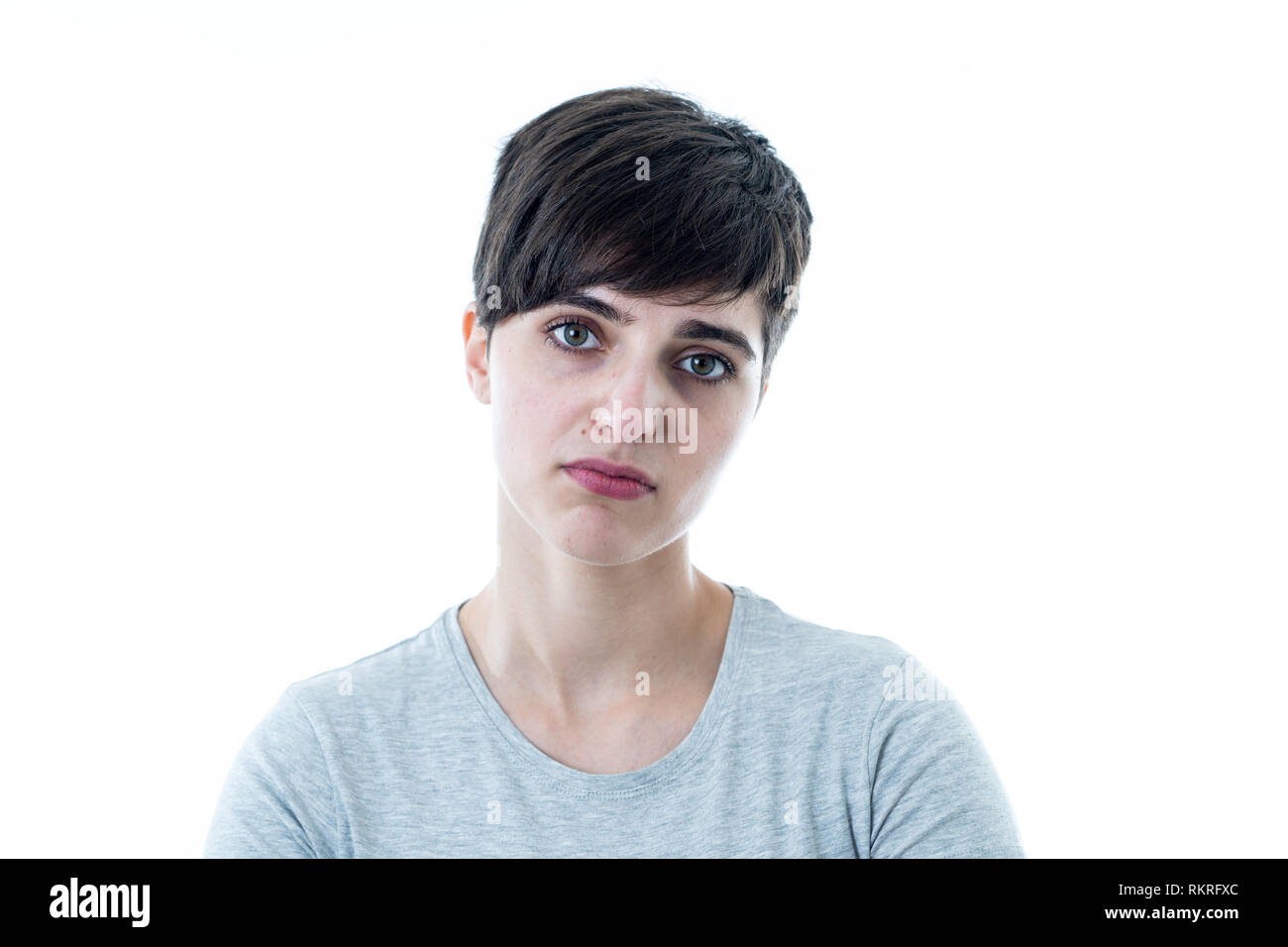 Close up portrait of beautiful young caucasian woman looking sad and ...