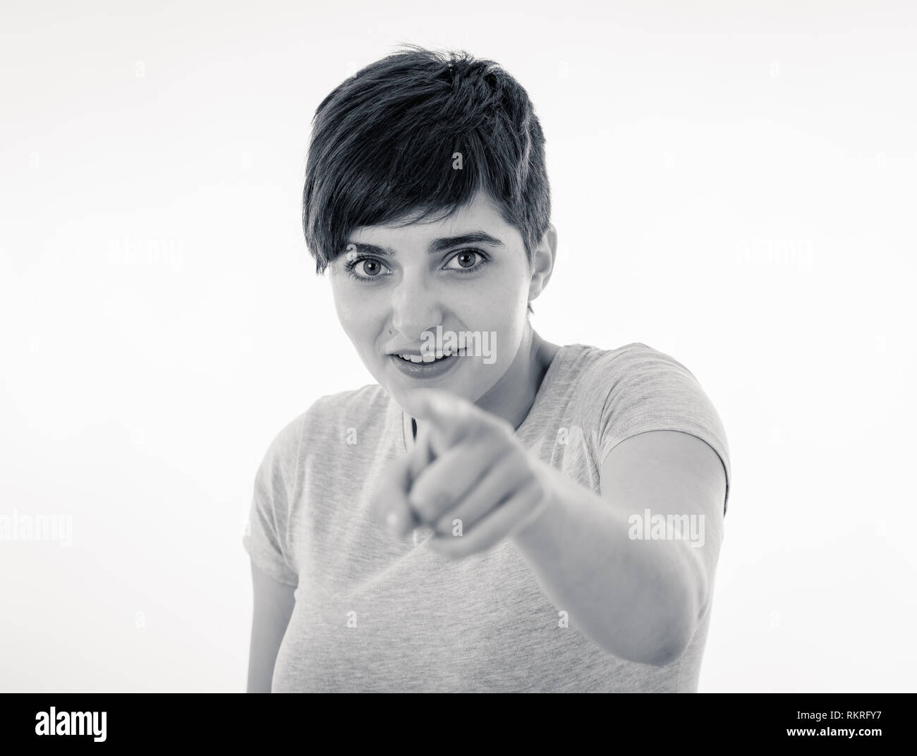 Close up portrait of scared and shocked young woman pointing at ...