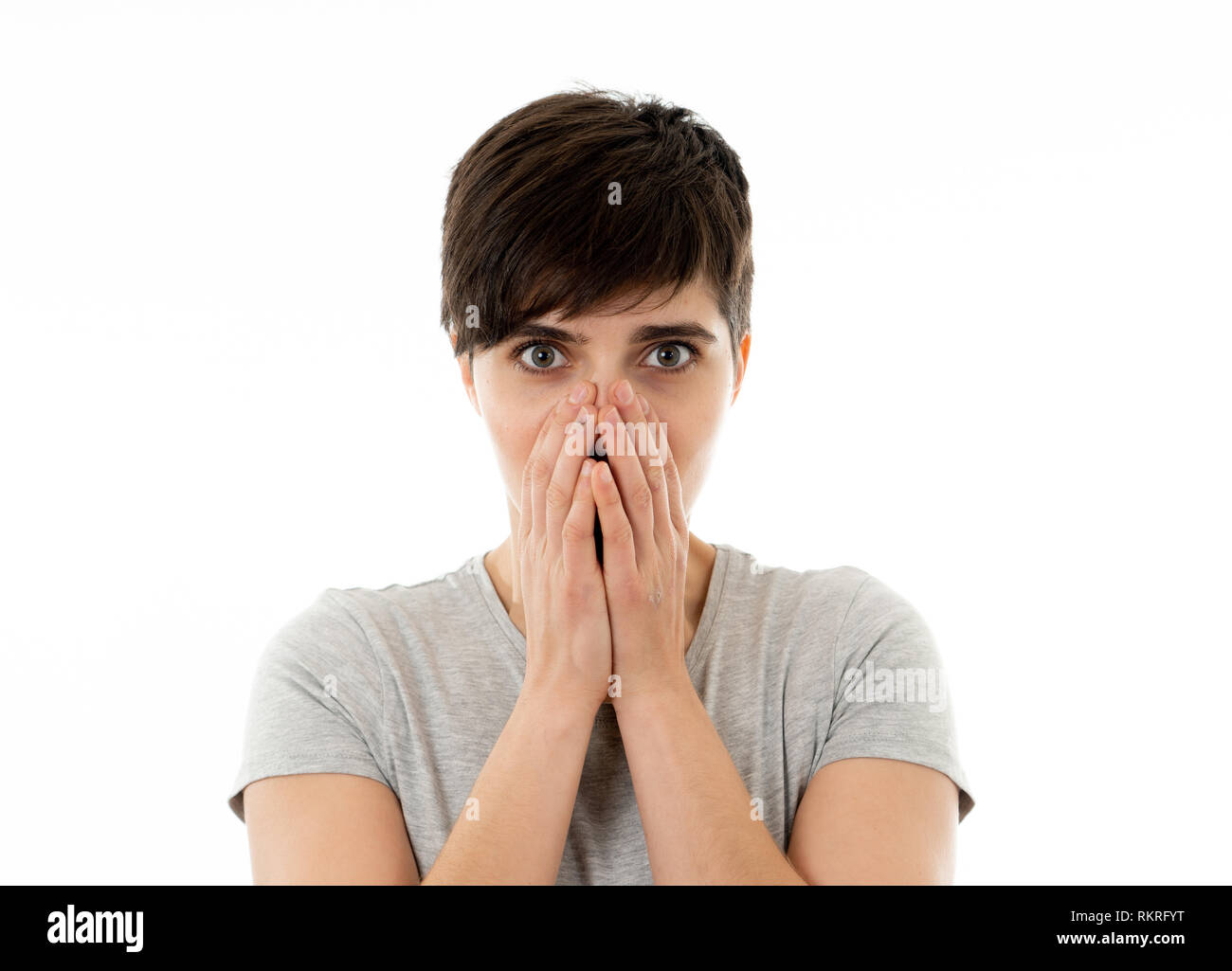 Close Up Portrait Of Young Woman Feeling Horrified And Shocked Looking
