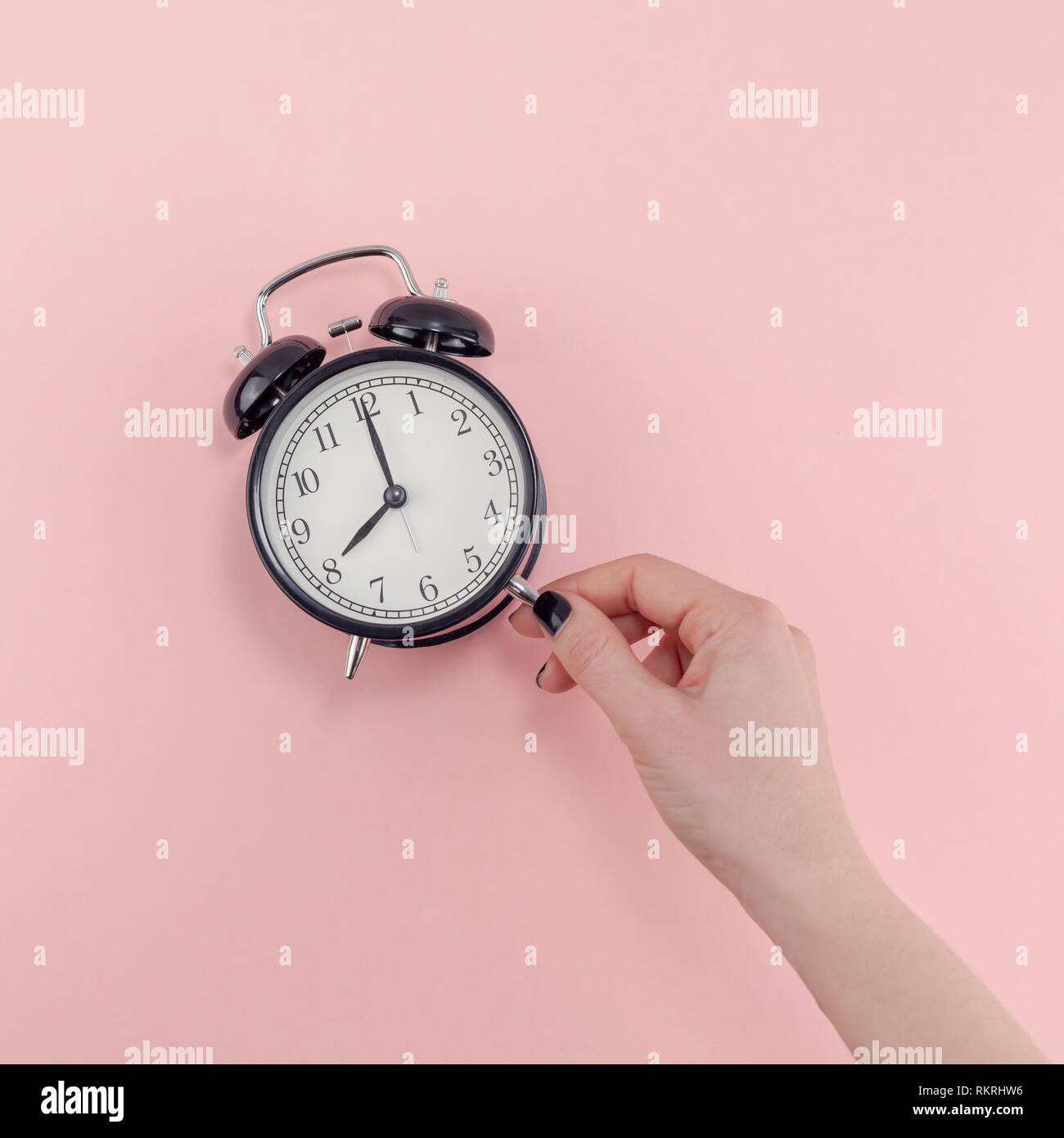 Creative flat lay morning time emotions concept top view of woman hand ...