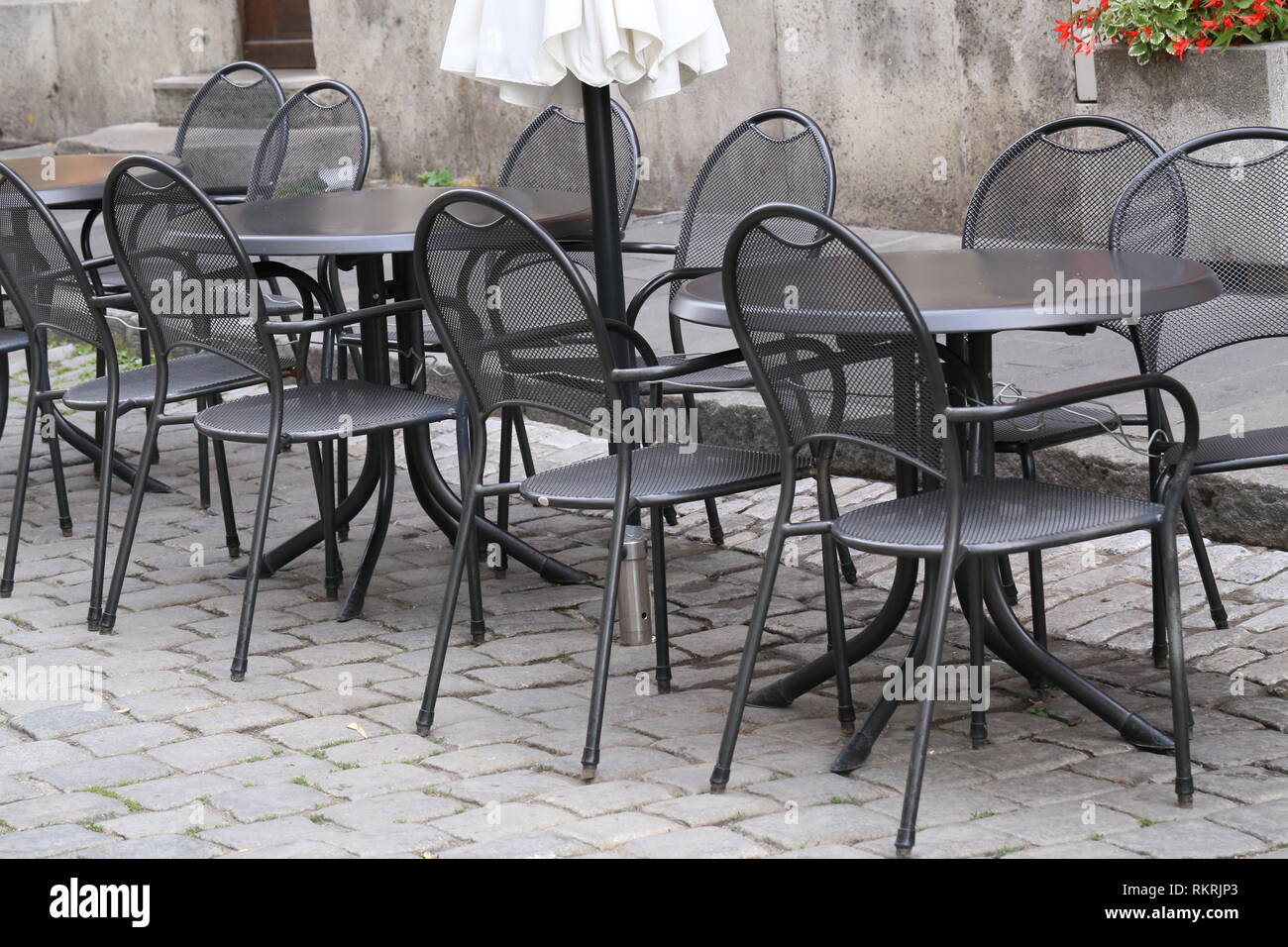 Cozy street restaurant. Tables and chairs in the streets Stock Photo ...