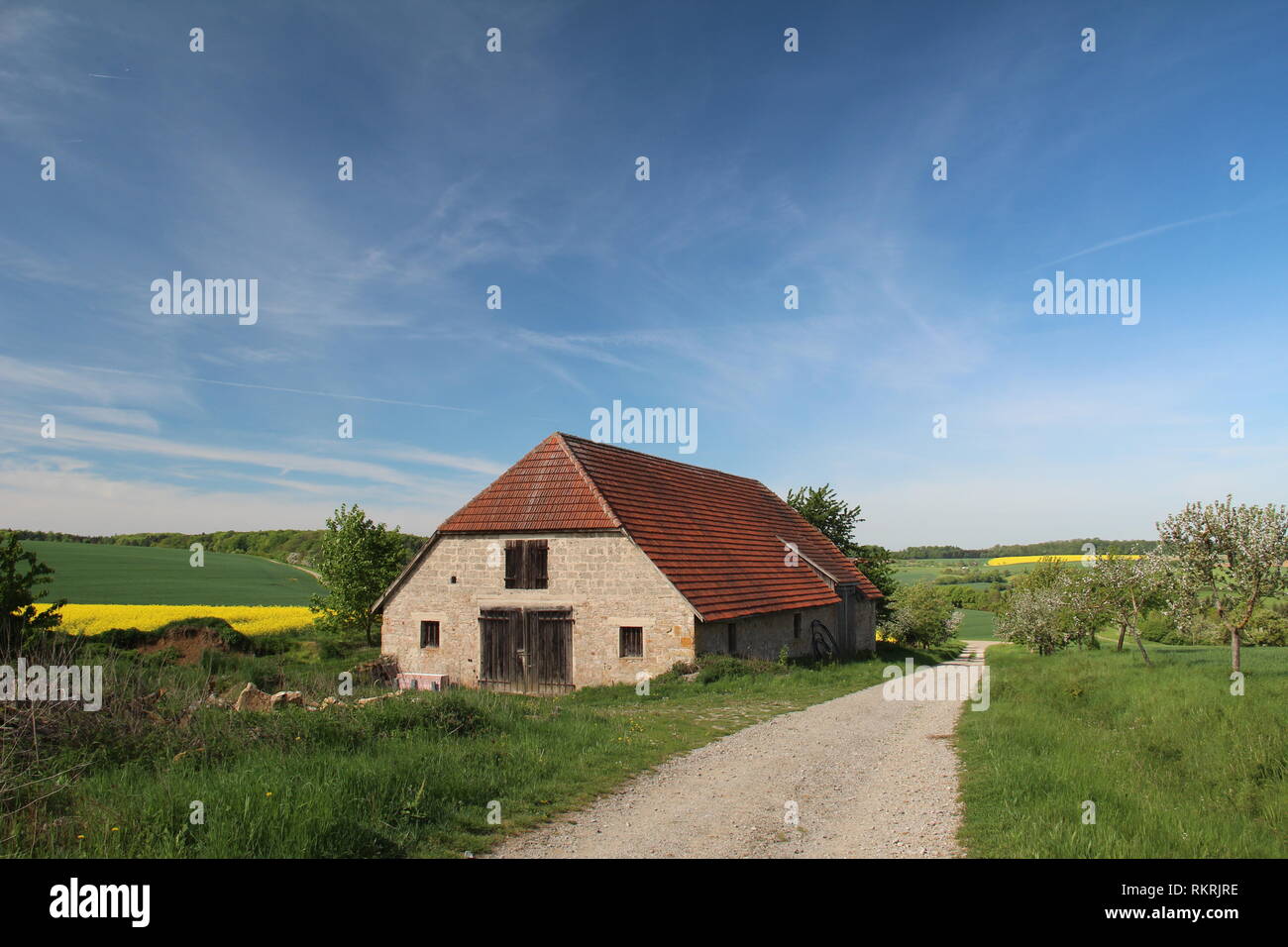 Barn near the road / Road running through fields, past the barn Stock ...