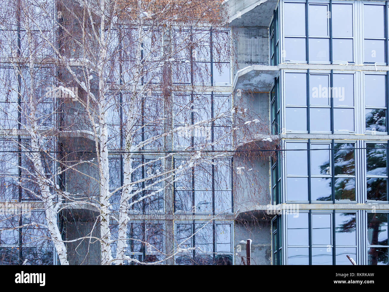 The glass facade of residential apartments in a high-rise building ...
