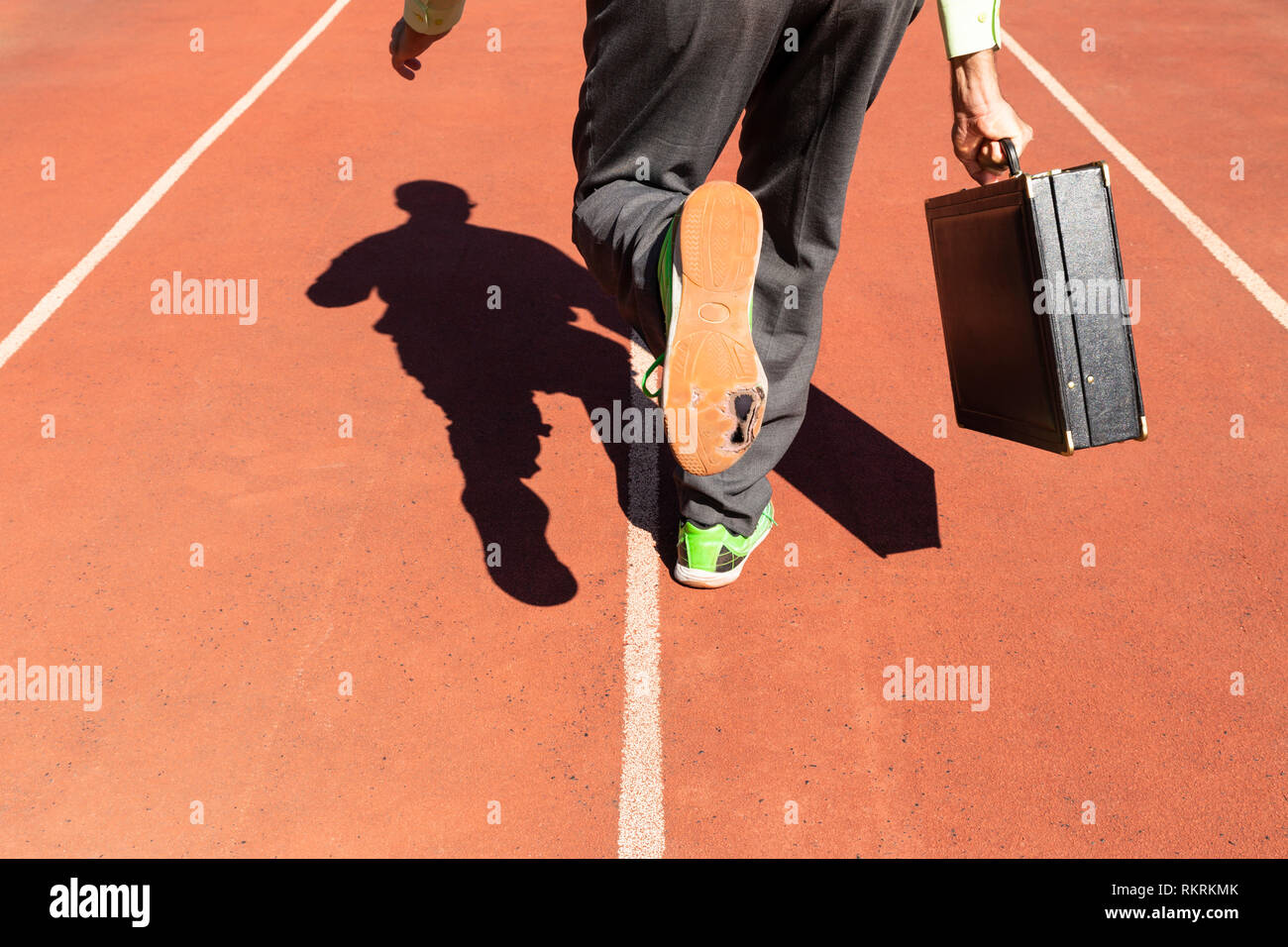 Man in suit running hi-res stock photography and images - Alamy