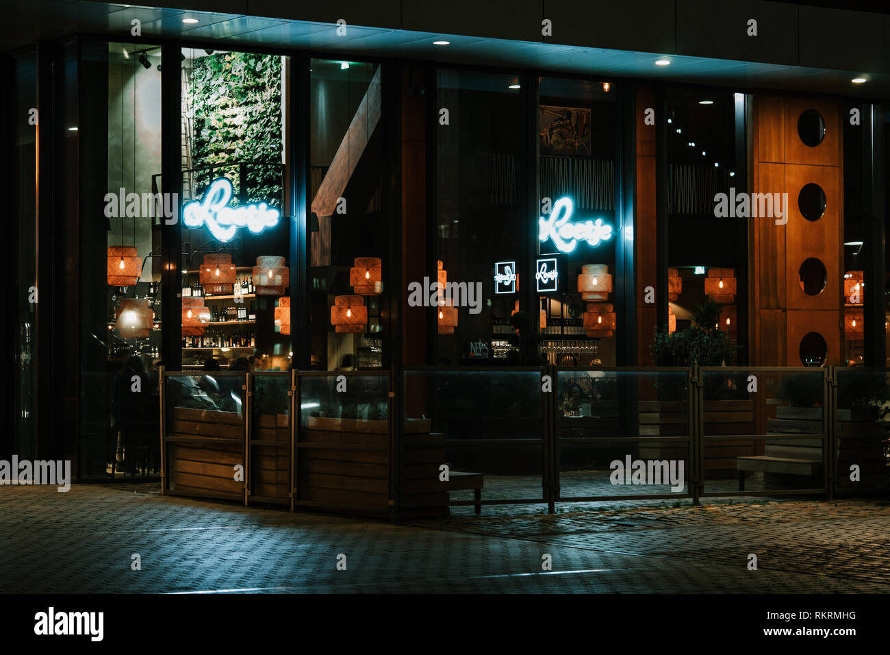 Illuminated bar in Rotterdam at night Stock Photo - Alamy