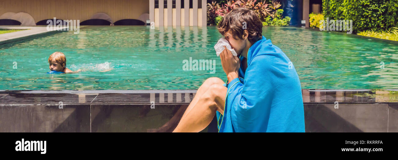 Sick man traveler. The man caught a cold on vacation, sits sad at the ...