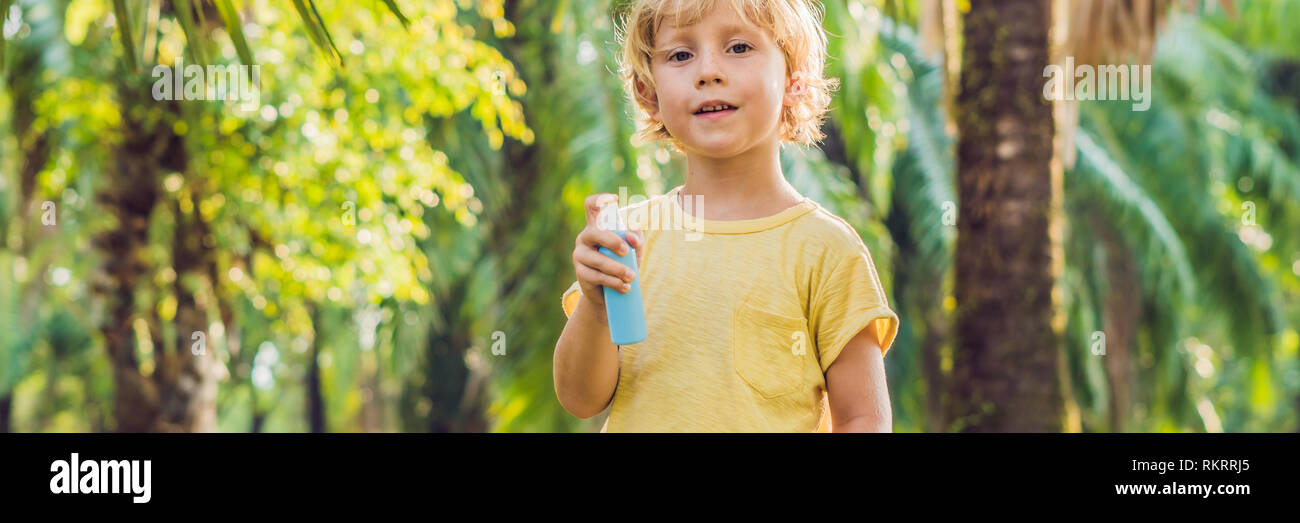 Boy spraying insect repellents on skin BANNER, long format Stock Photo ...