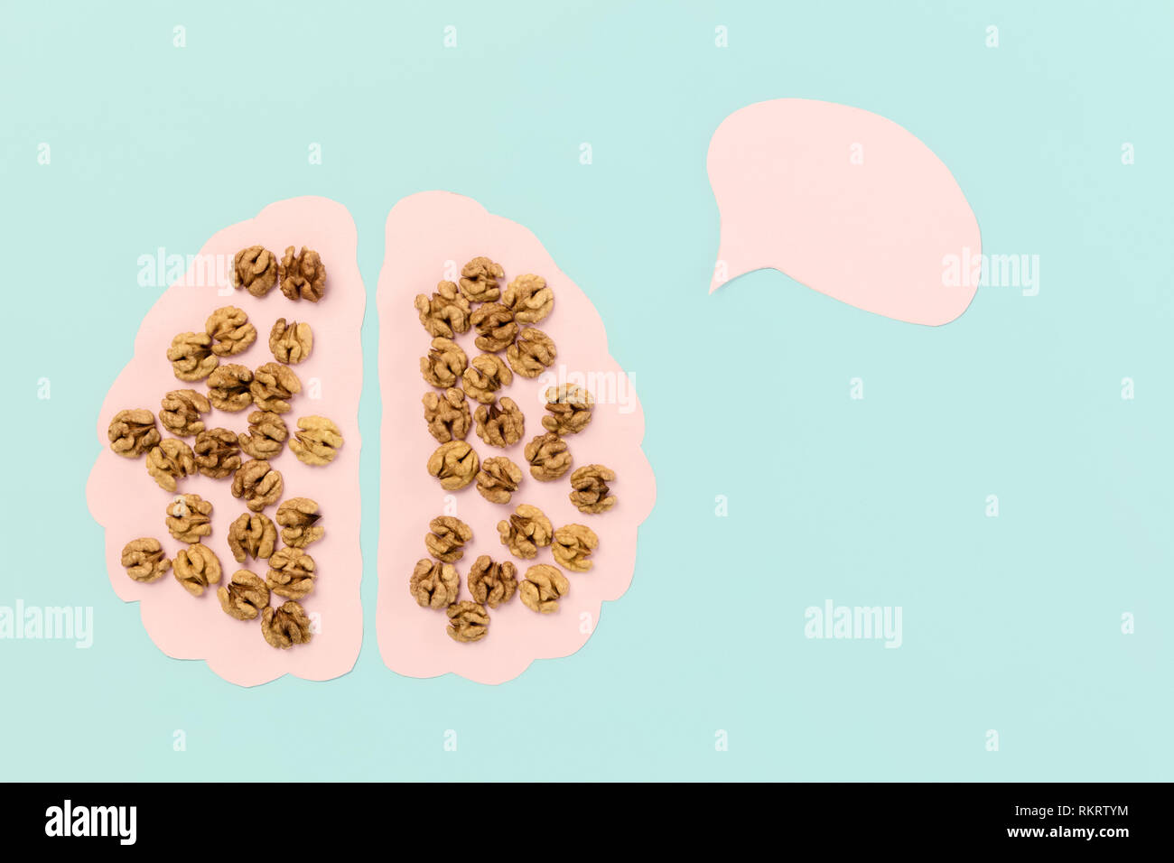 Walnuts as healthy food for the brain. Walnut kernels in shape of human ...