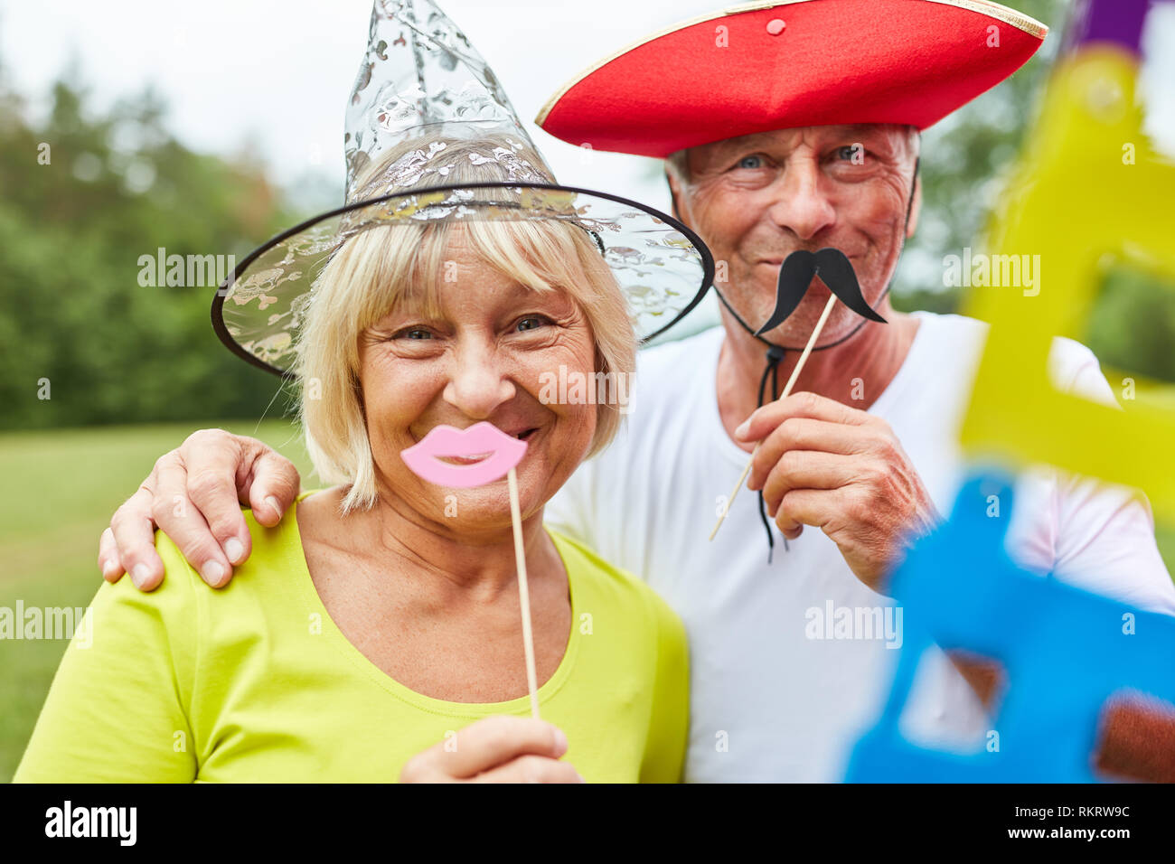 Two seniors in colorful costumes at a carnival or carnival party Stock ...